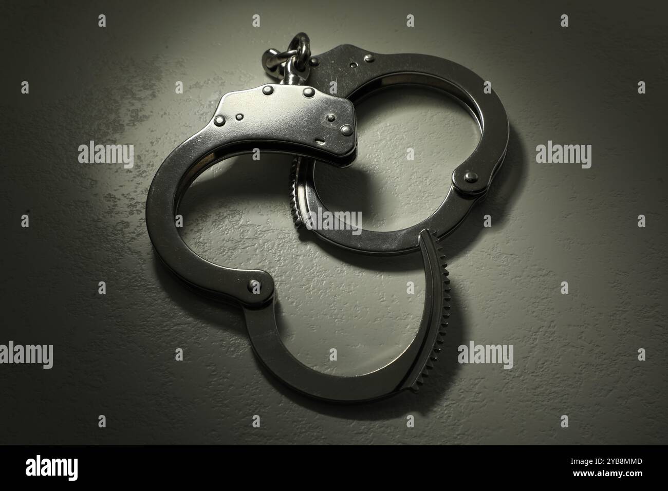 Classic chain handcuffs on grey table, closeup Stock Photo - Alamy