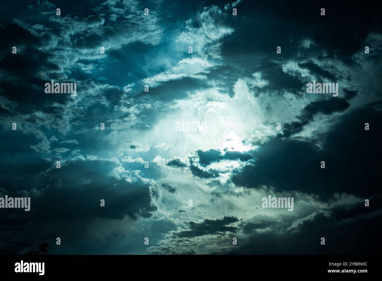 Bright and Dark Clouds with Shining Sun Rays Stock Photo - Alamy