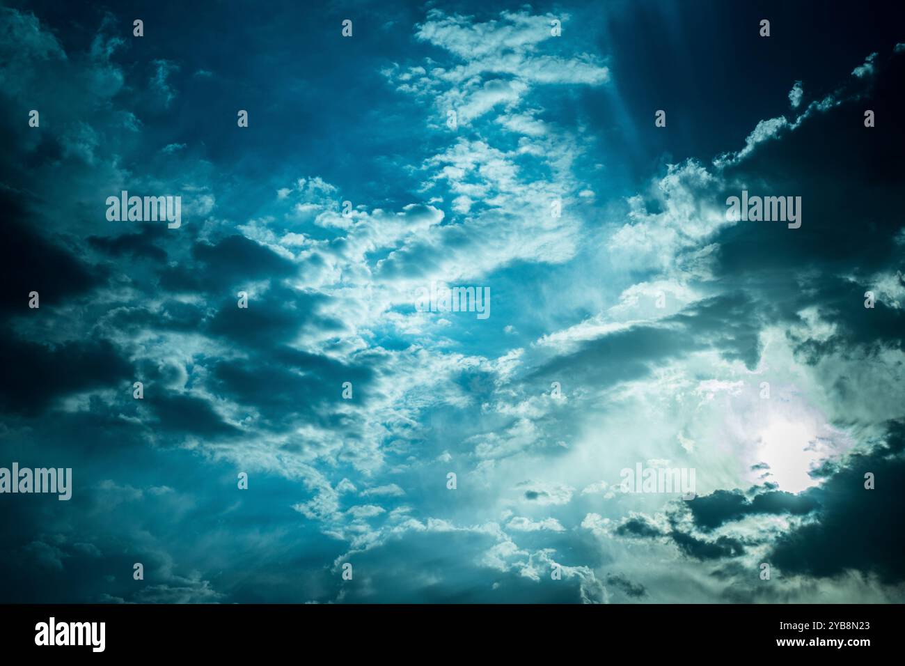 Bright and Dark Clouds with Shining Sun Rays Stock Photo - Alamy