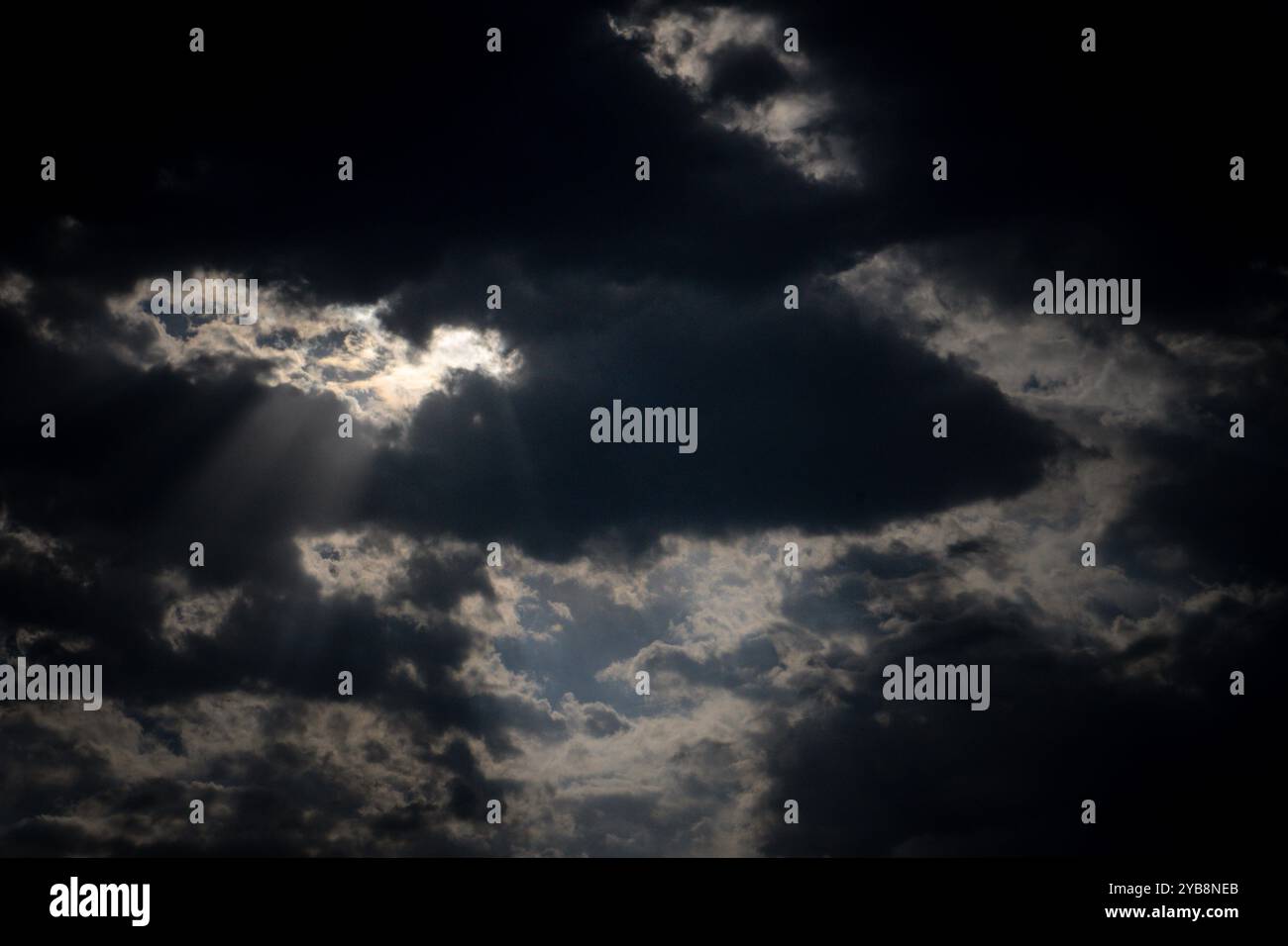 Bright and Dark Clouds with Shining Sun Rays Stock Photo - Alamy