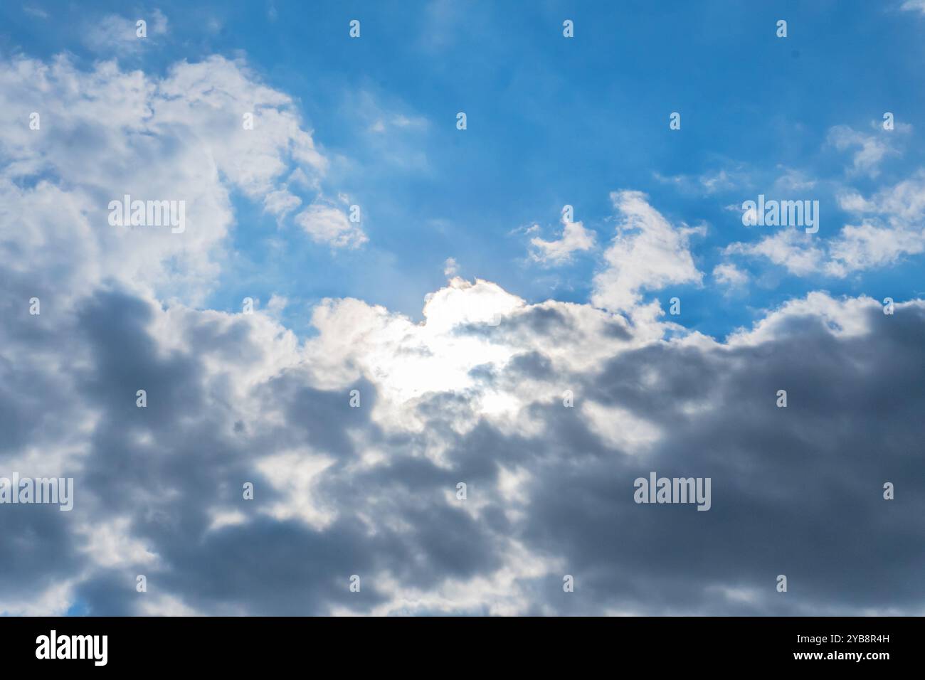 Bright and Dark Clouds with Shining Sun Rays Stock Photo - Alamy