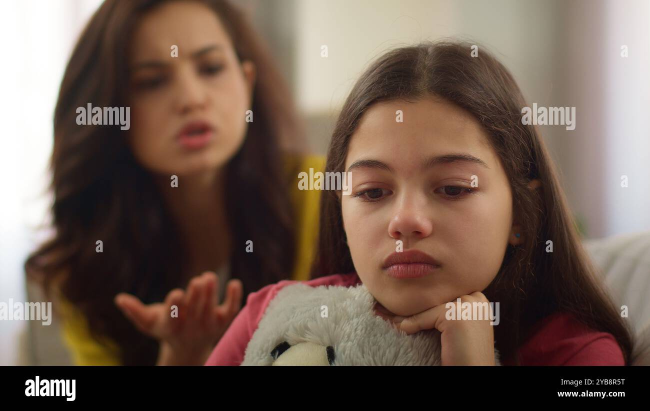 Angry furious Caucasian woman female shouting mother mom yelling parent argument quarrel ...