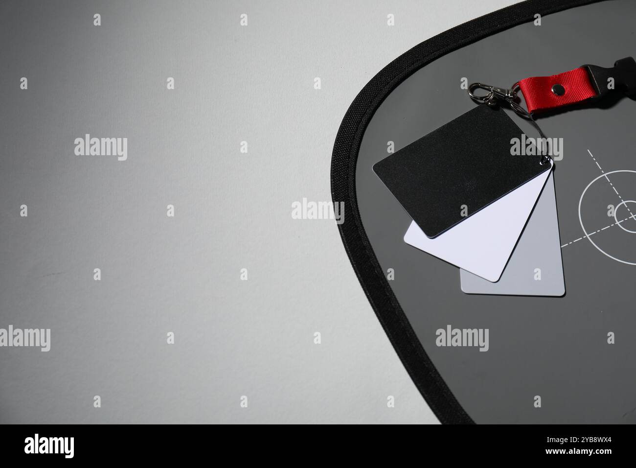 White balance calibration cards on light background, closeup. Space for ...