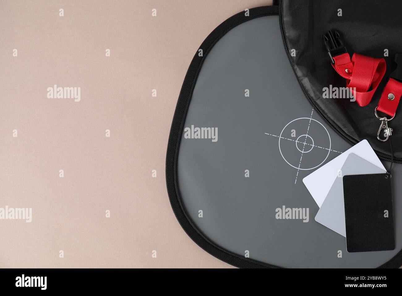 White balance calibration cards on beige background, top view. Space ...