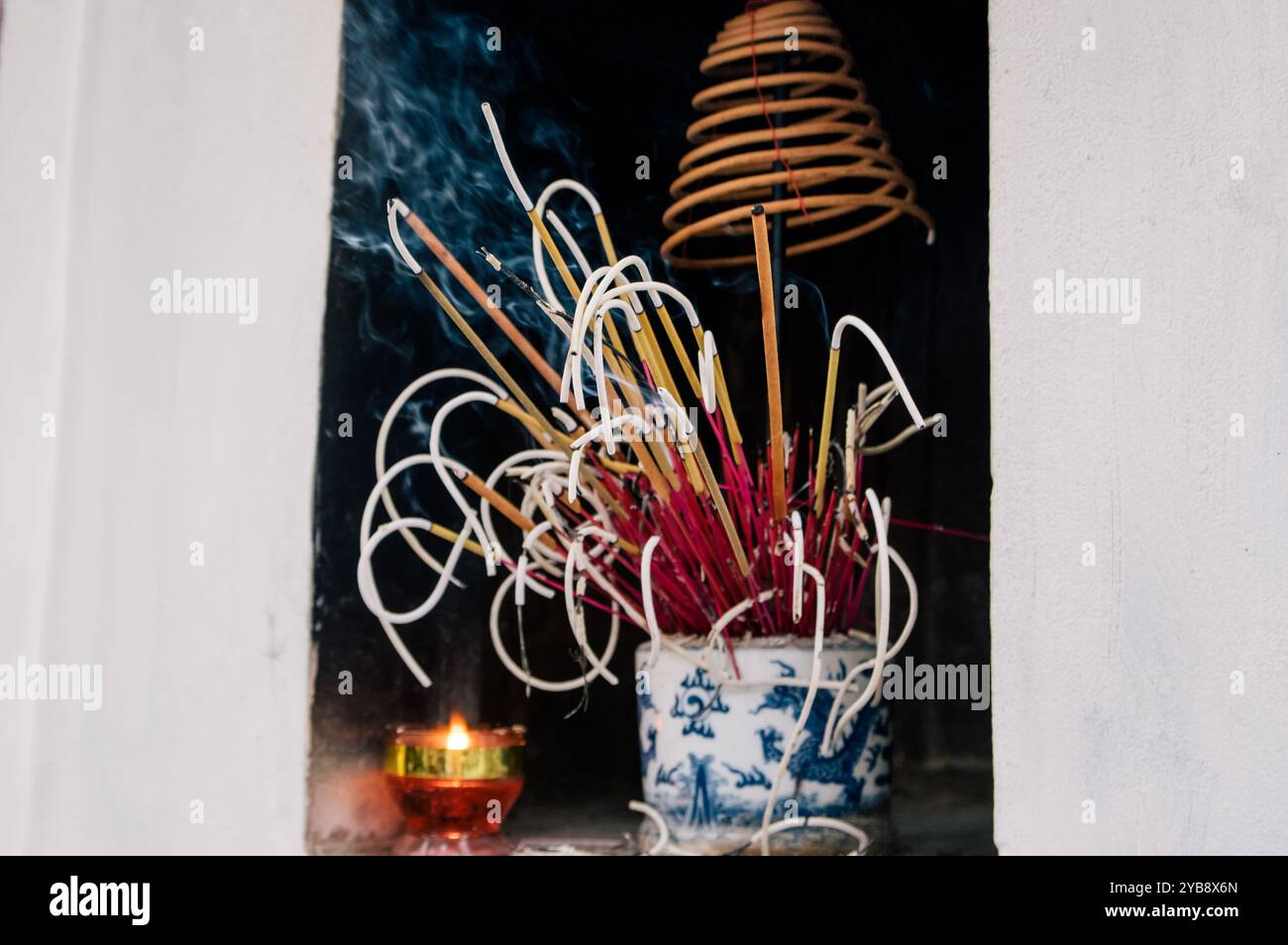 Traditional asian buddhist incense sticks burning with smoke thick ...