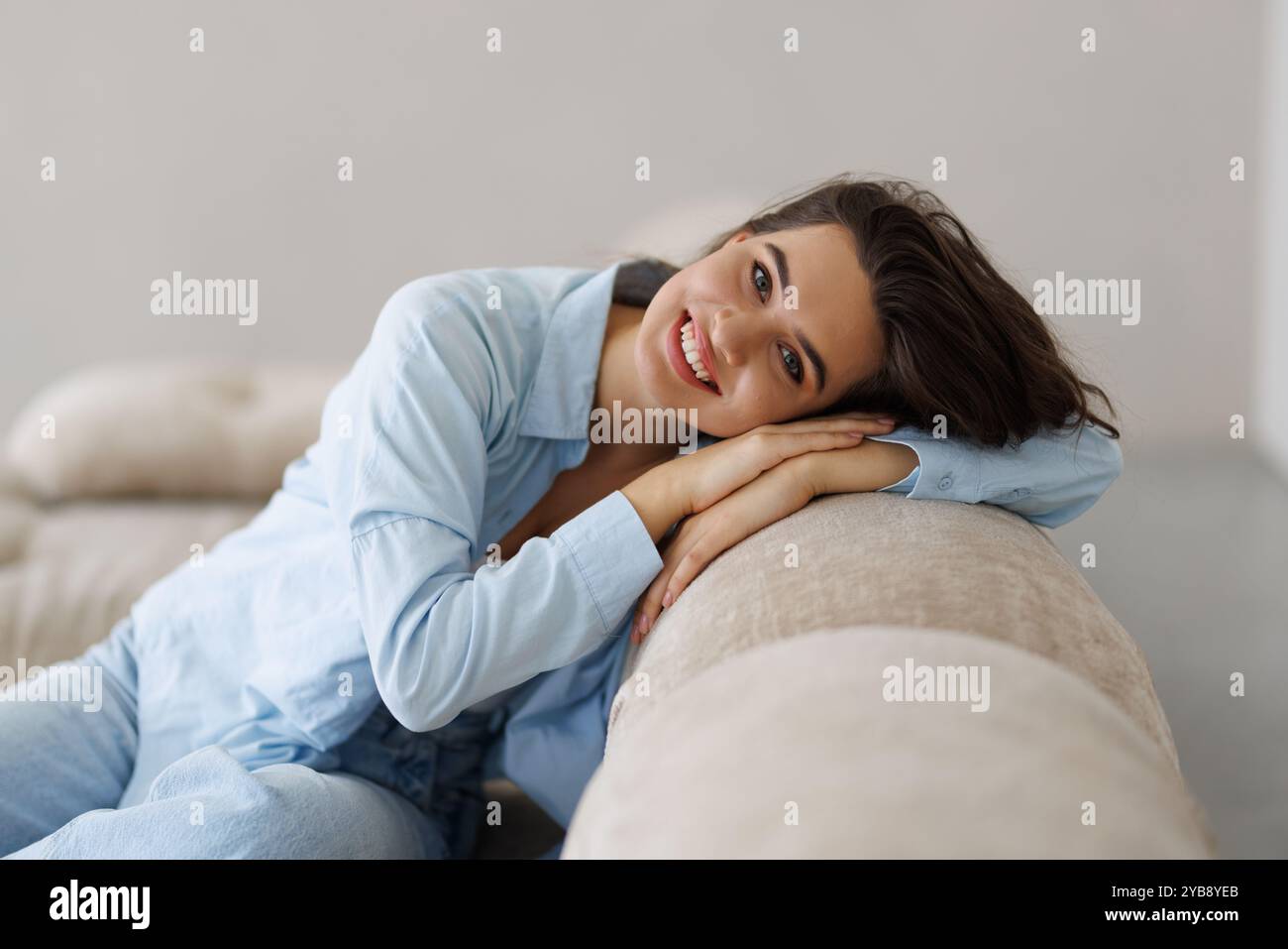 Relaxed serene pretty young woman feel fatigue lounge on comfortable ...