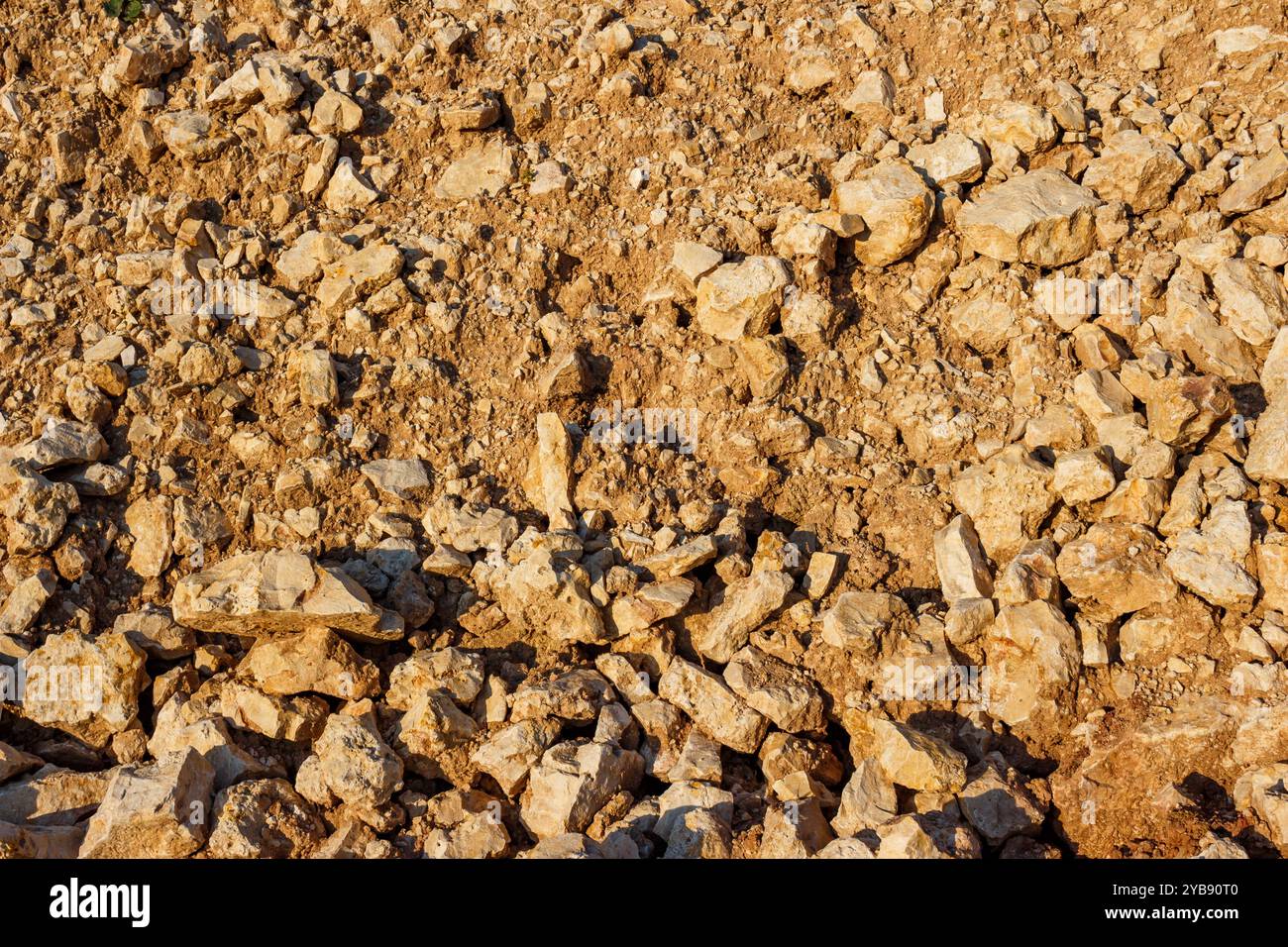 Mound of limestone rubble for crushed stone production Stock Photo - Alamy