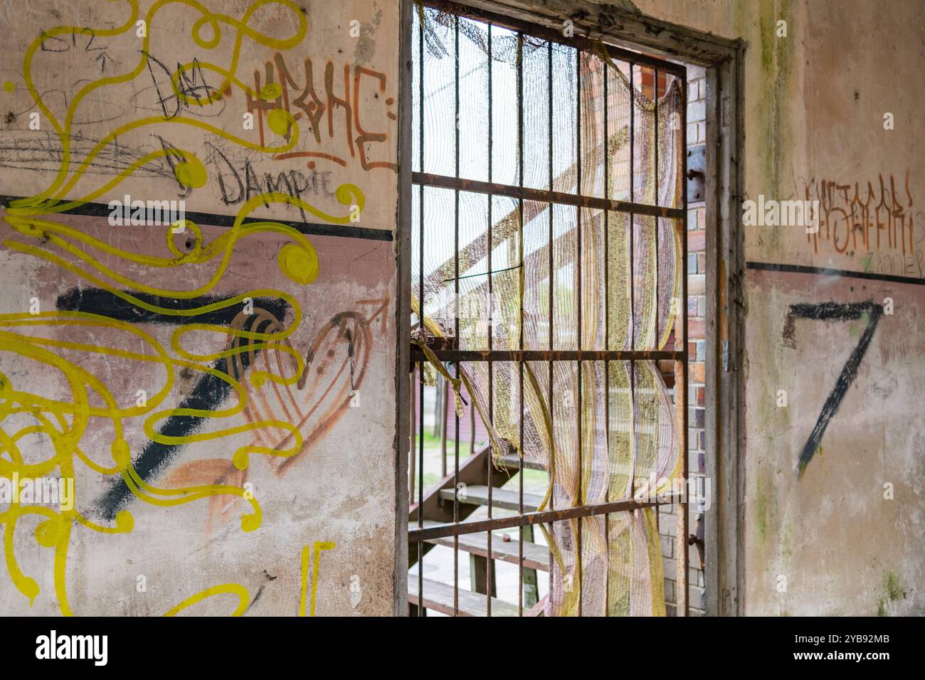 A view of a window grille inside an abandoned derelict power station ...