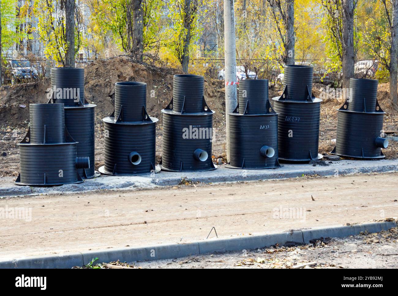 Modern plastic wells for underground communications Stock Photo - Alamy