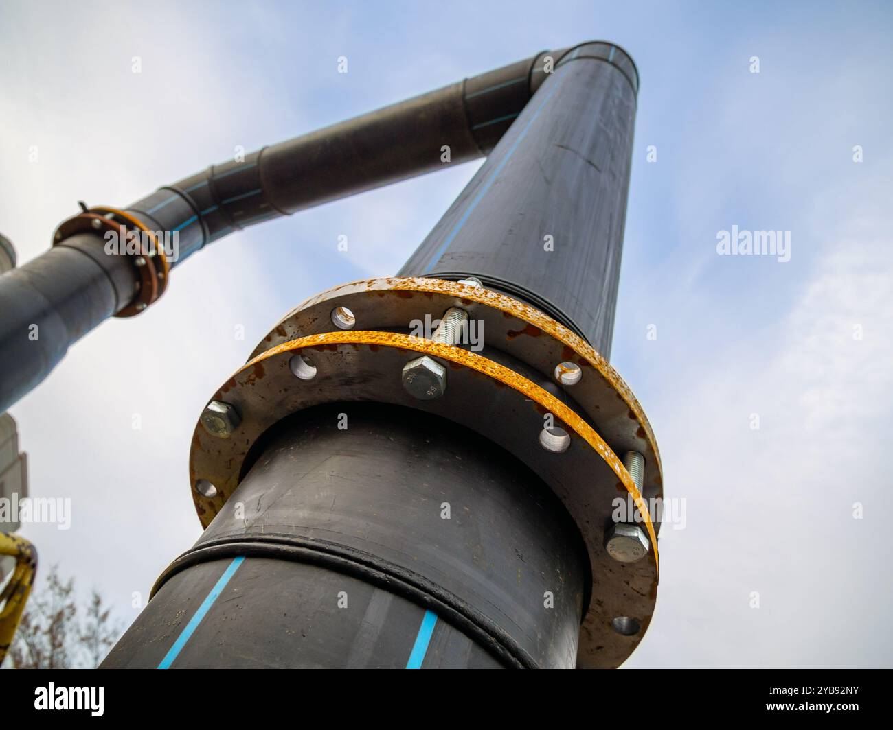 Connecting two sections of plastic pipeline using a flange Stock Photo ...