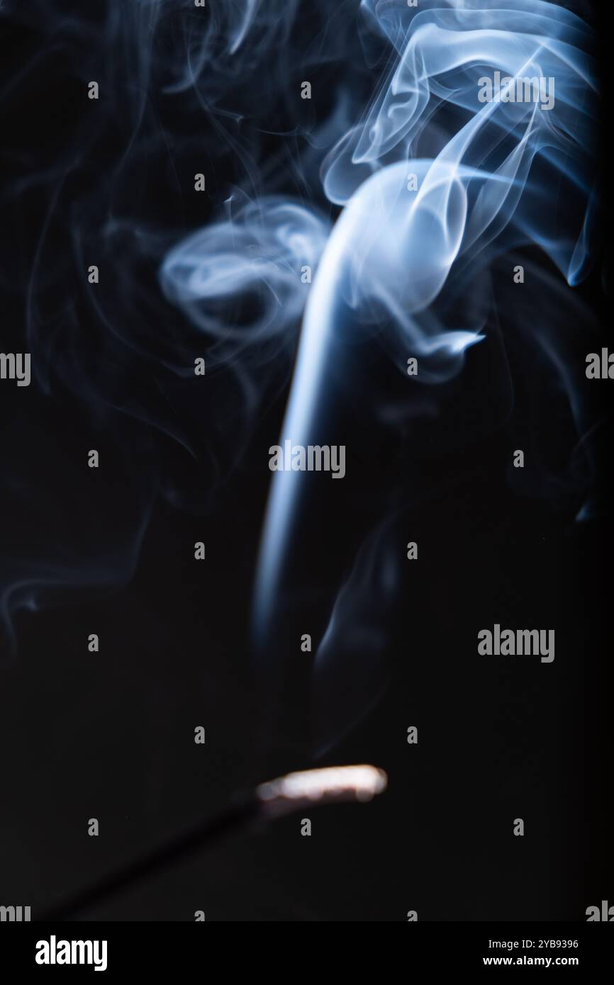 Wisps of smoke rise in hi-res stock photography and images - Alamy