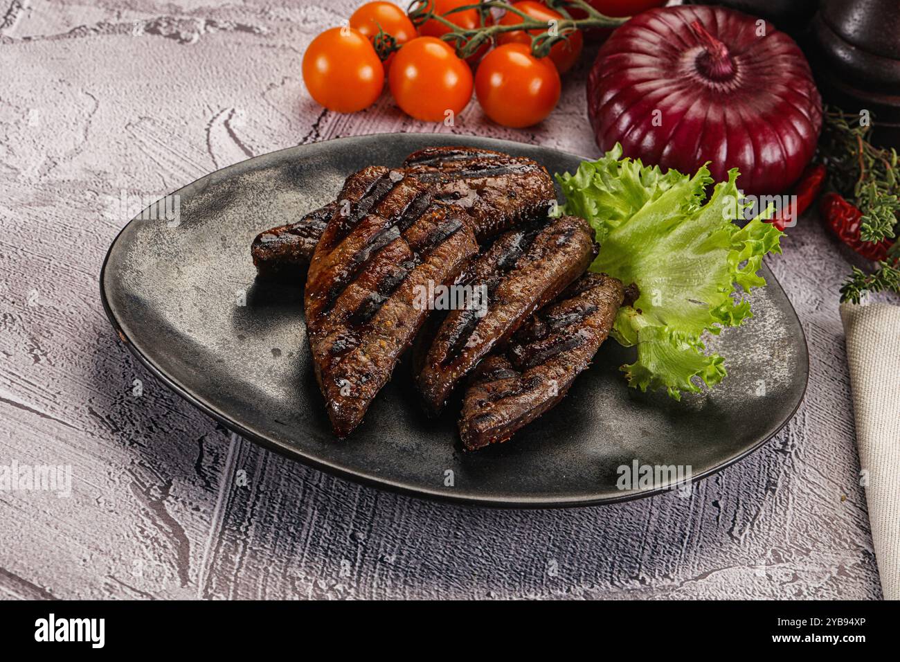 Grilled diet beef liver steak in the plate Stock Photo - Alamy