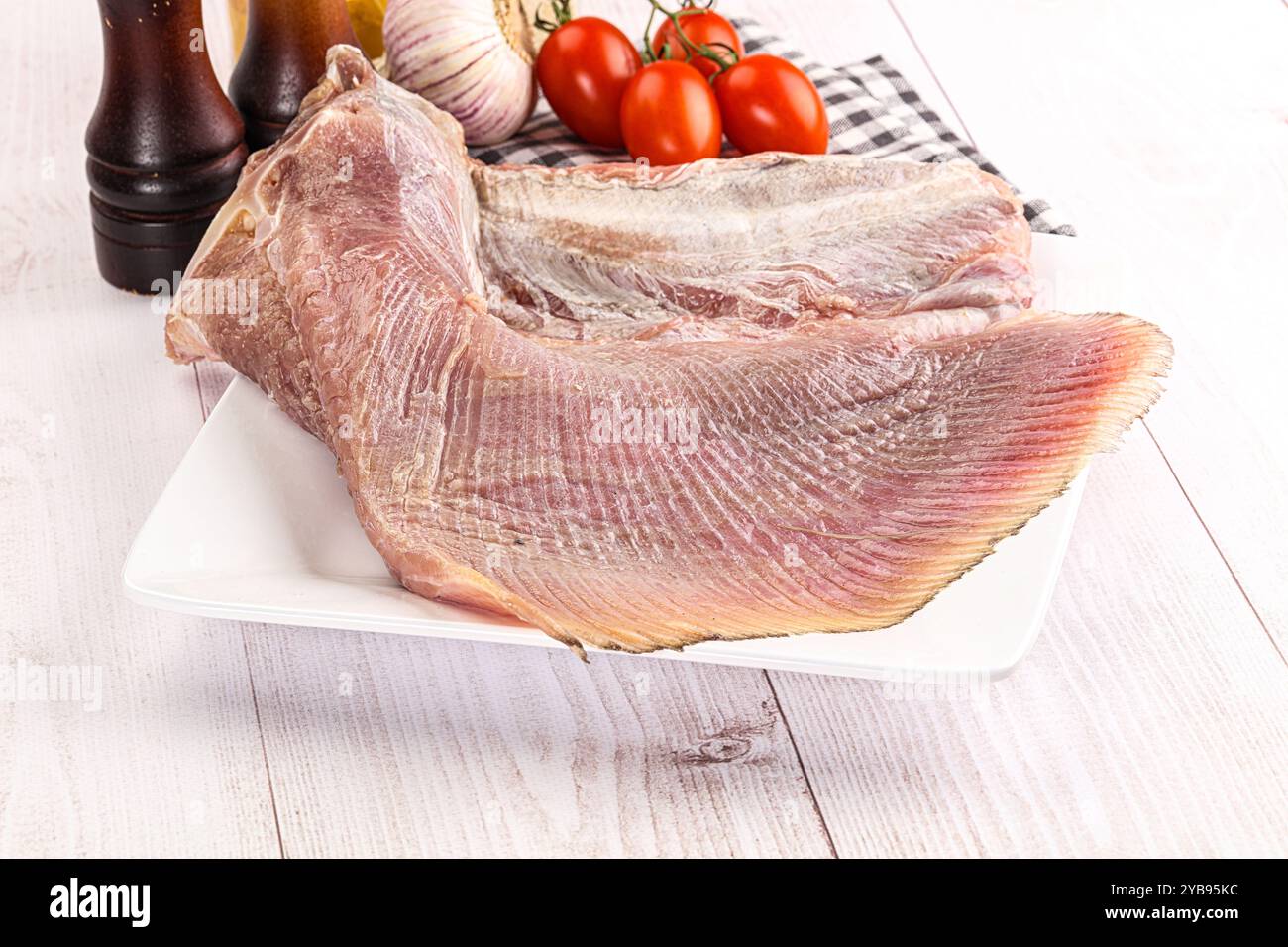 Raw uncooked stingray fish wing in thw plate Stock Photo - Alamy