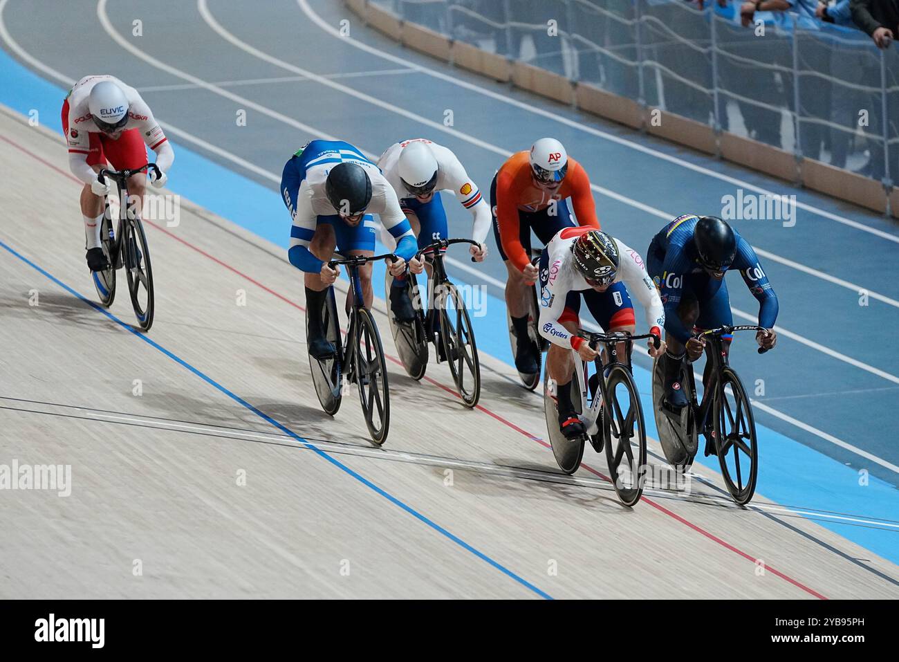 Japan's Kento Yamasaki, in white, leads the men's keirin race in the ...