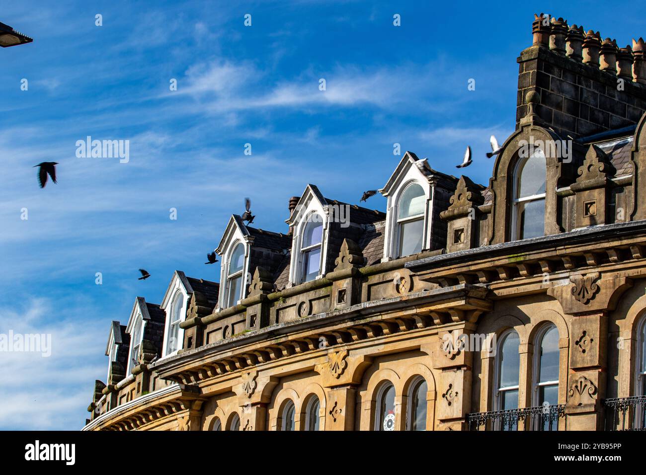 A historic building with ornate architecture, featuring multiple gabled ...