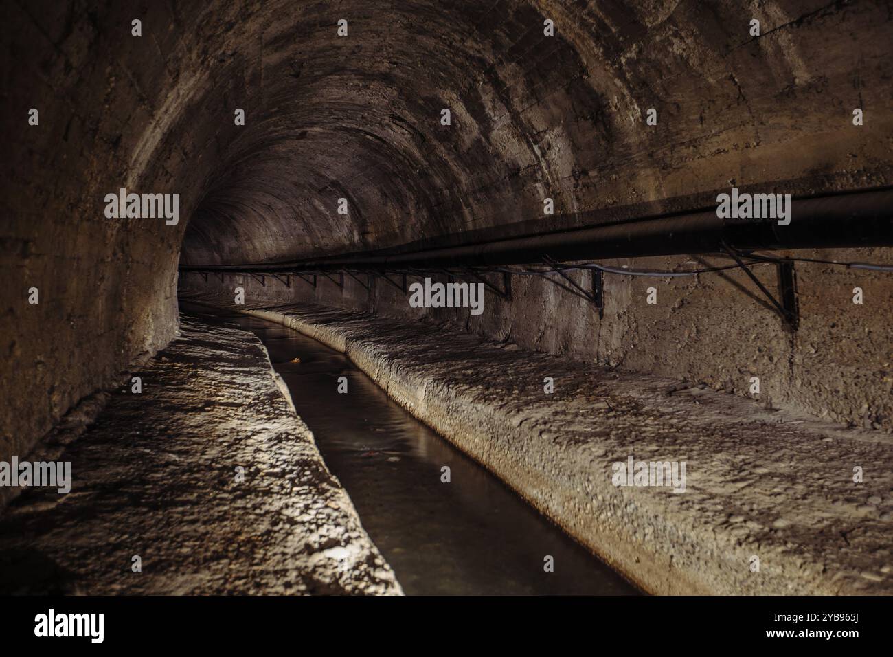 Underground vaulted urban sewer tunnel with dirty sewage Stock Photo ...