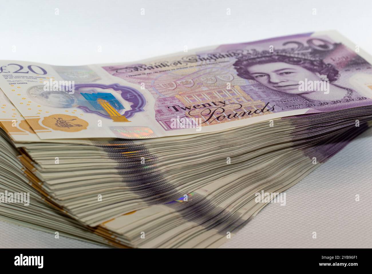 A stack of new twenty pound British banknotes arranged neatly ...