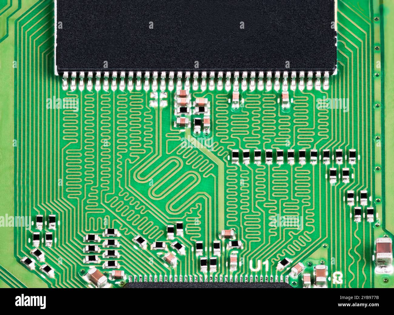 Closeup a high-speed printed circuit board with electronic components. Green PCB with different ...