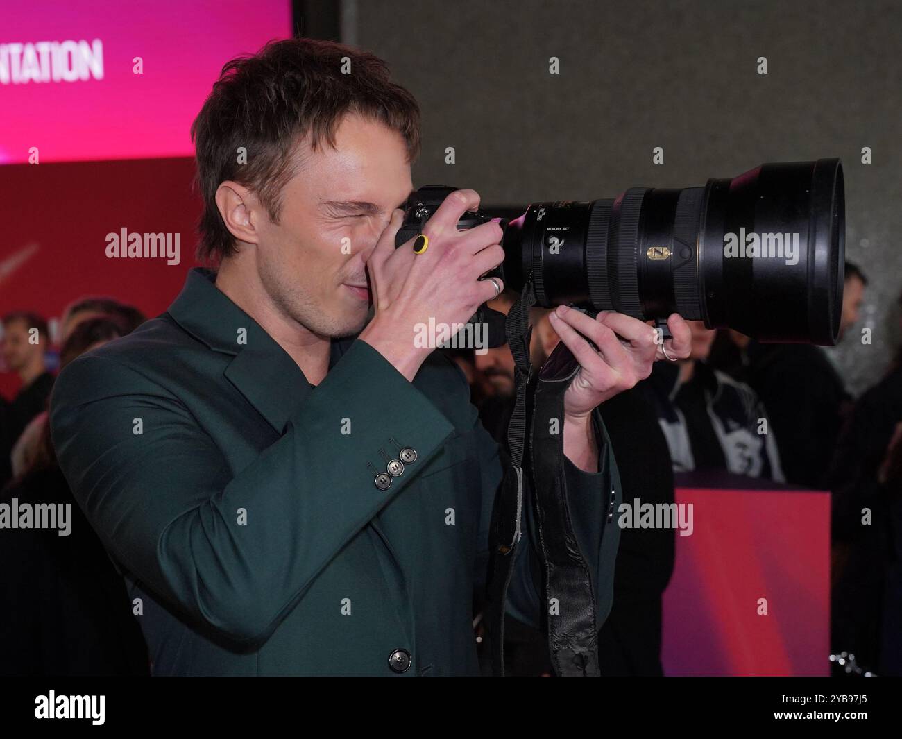 Drew Starkey, uses a photographer's camera as he attends the BFI London ...