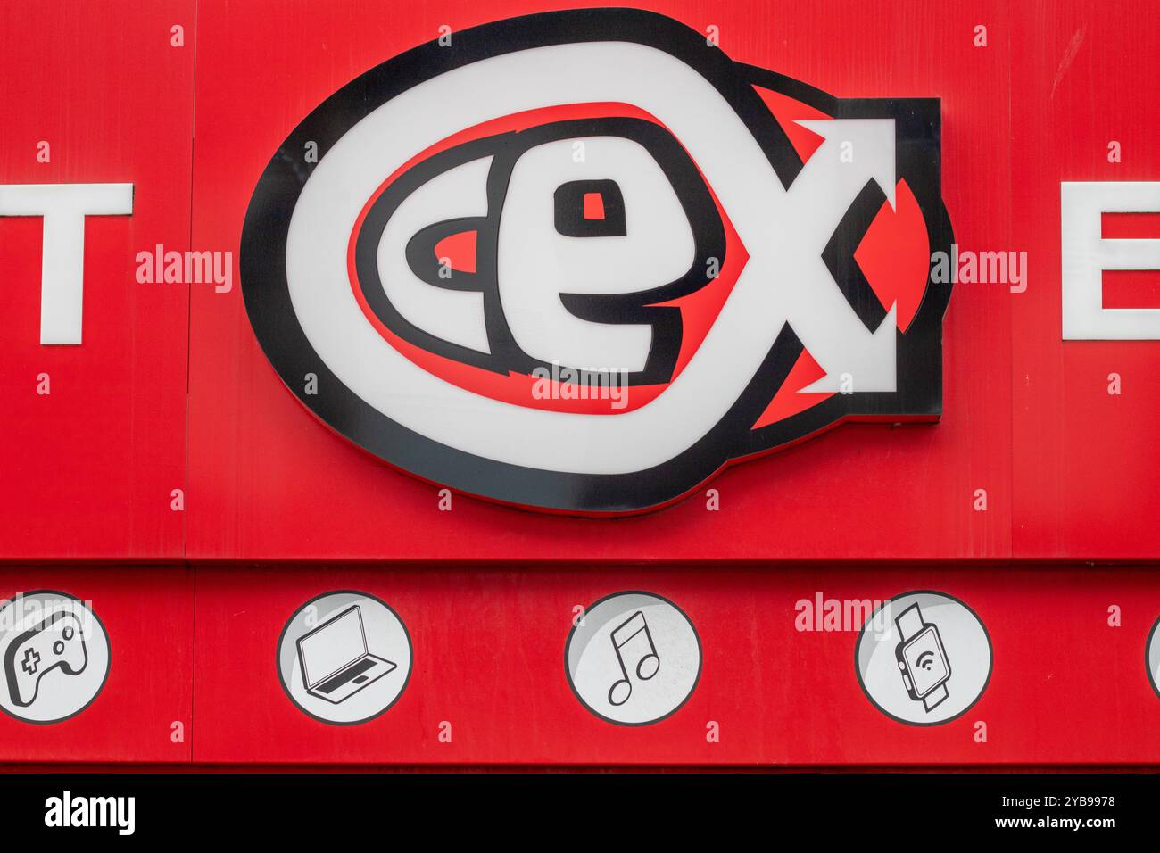 A close-up of a red storefront sign featuring the logo of a retail ...