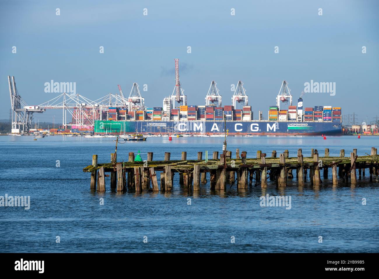 large container ship alongside in the port of Southampton docks at the ...