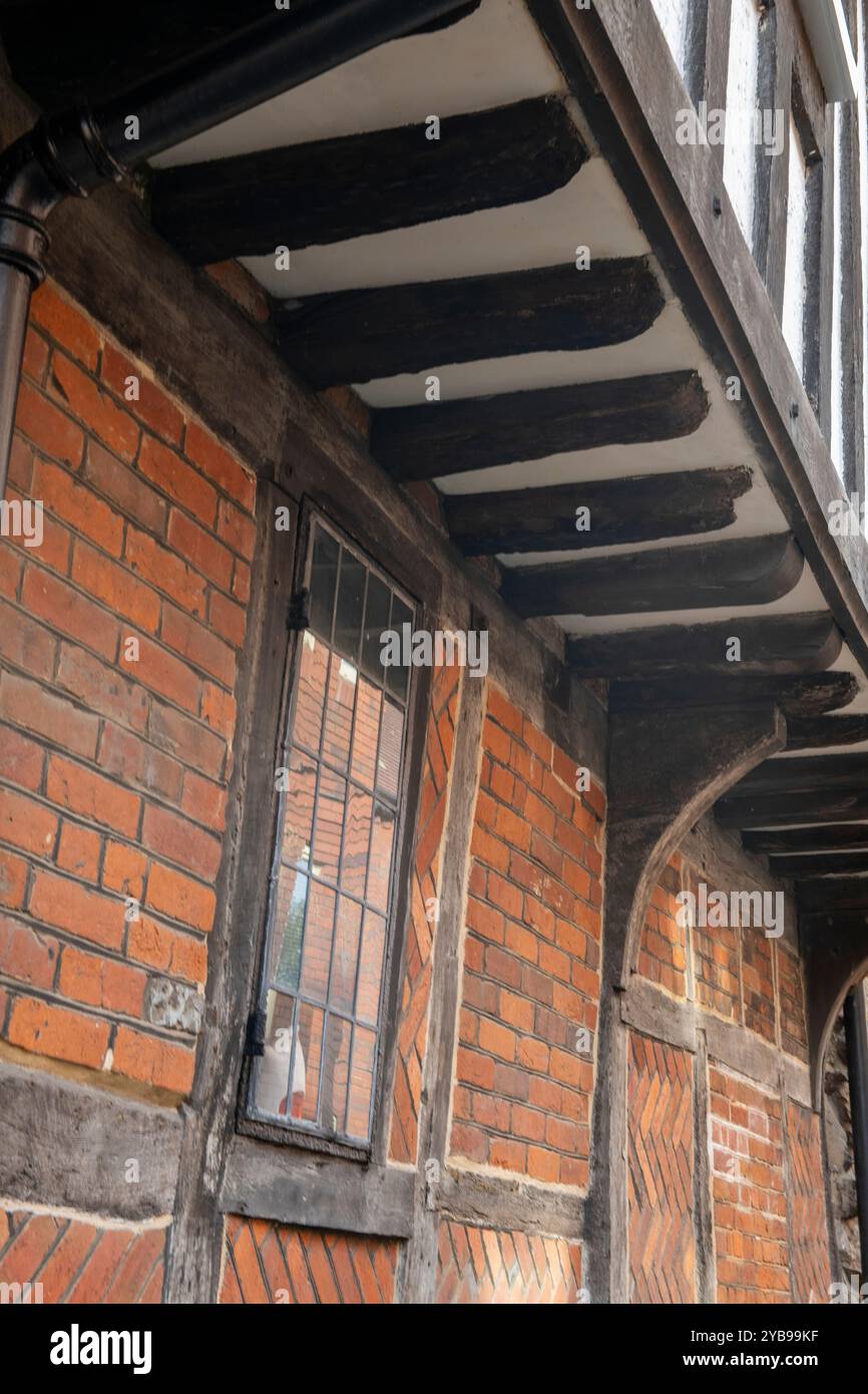 architectural details of the timbers and overhang of the upper floor of ...