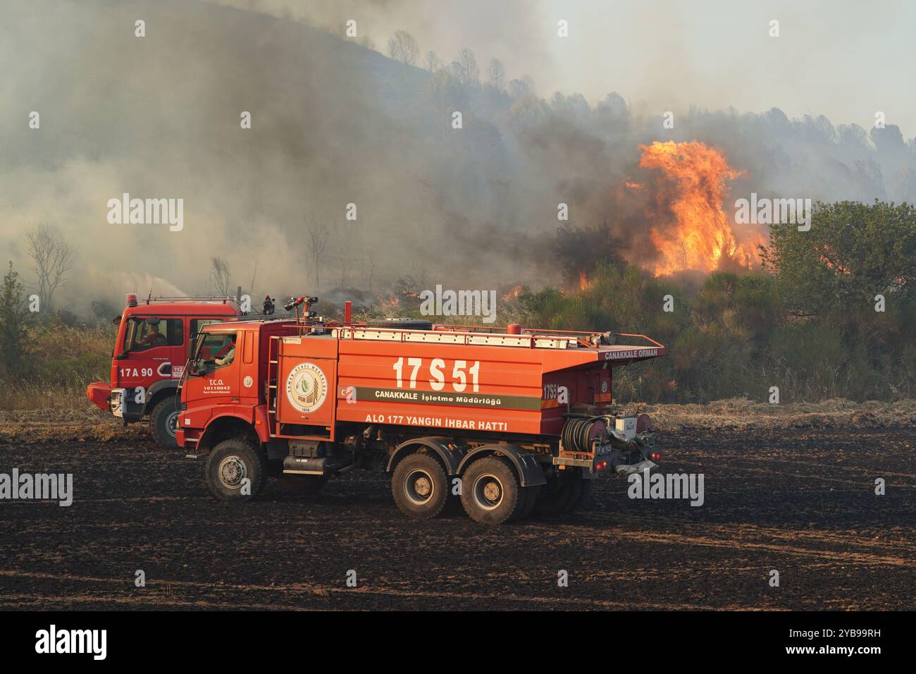 CANAKKALE, TURKIYE - JUNE 18, 2024: Firefighters extinguish forest fire ...