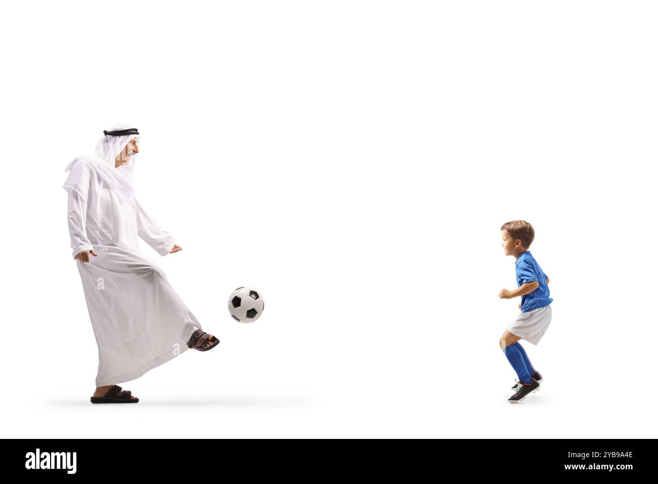 Arab man playing football with a boy isolated on white background Stock ...