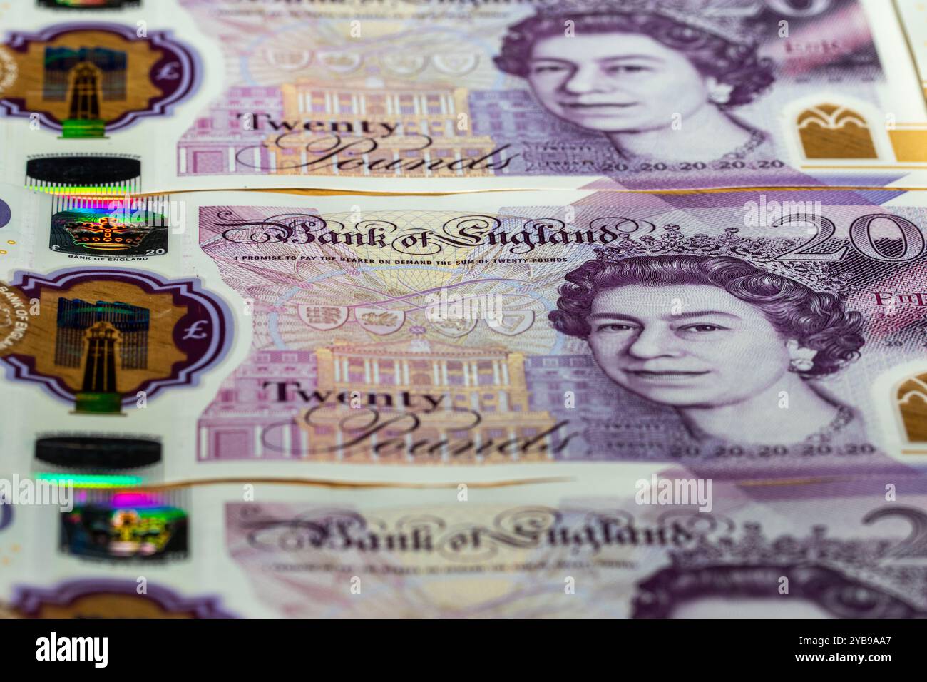 Closeup image of a stack of twenty pound banknotes featuring Queen ...