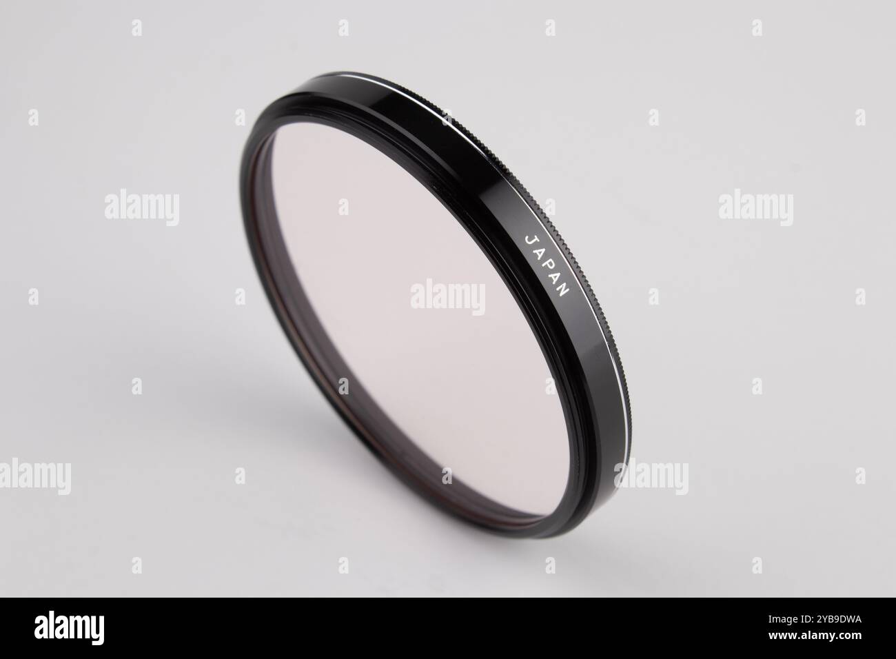 Skylight 1A photographic filter isolated on light grey background ...