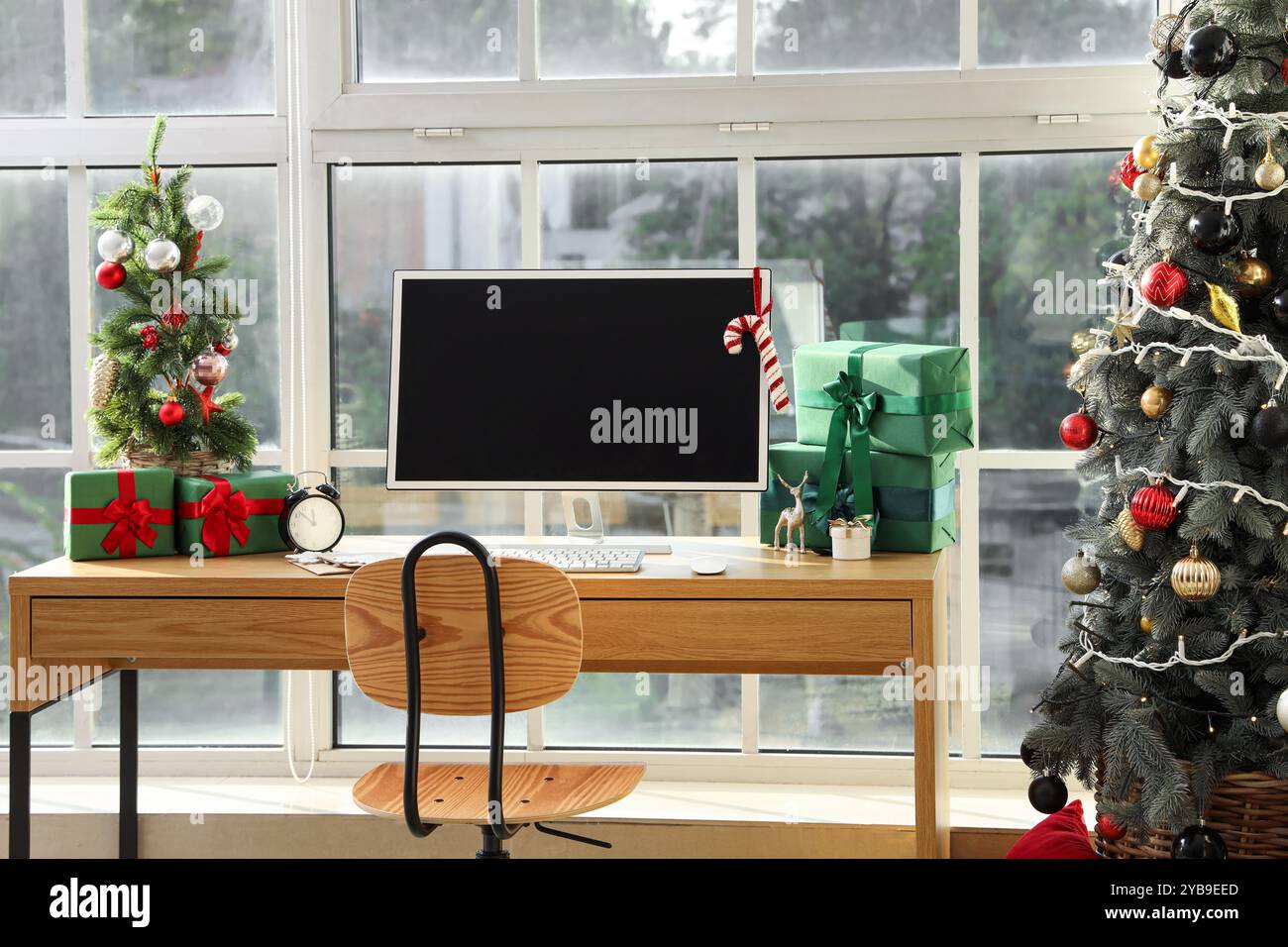 Interior of office with workplace and Christmas trees Stock Photo - Alamy
