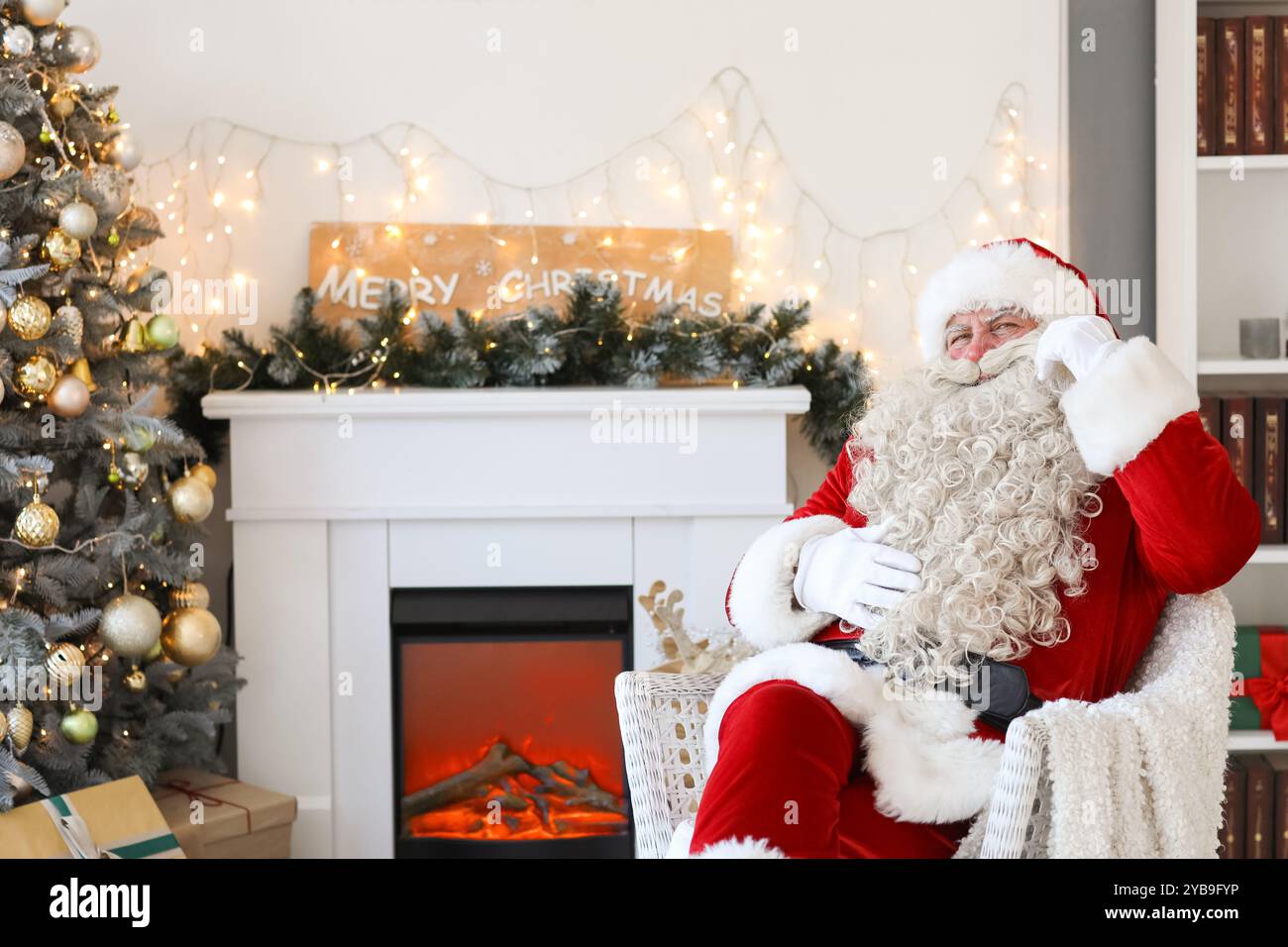 Santa Claus at home on Christmas eve Stock Photo - Alamy