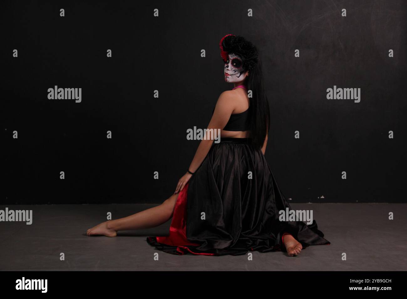 Dancer woman with skull makeup dances to celebrate the Day of the Dead ...
