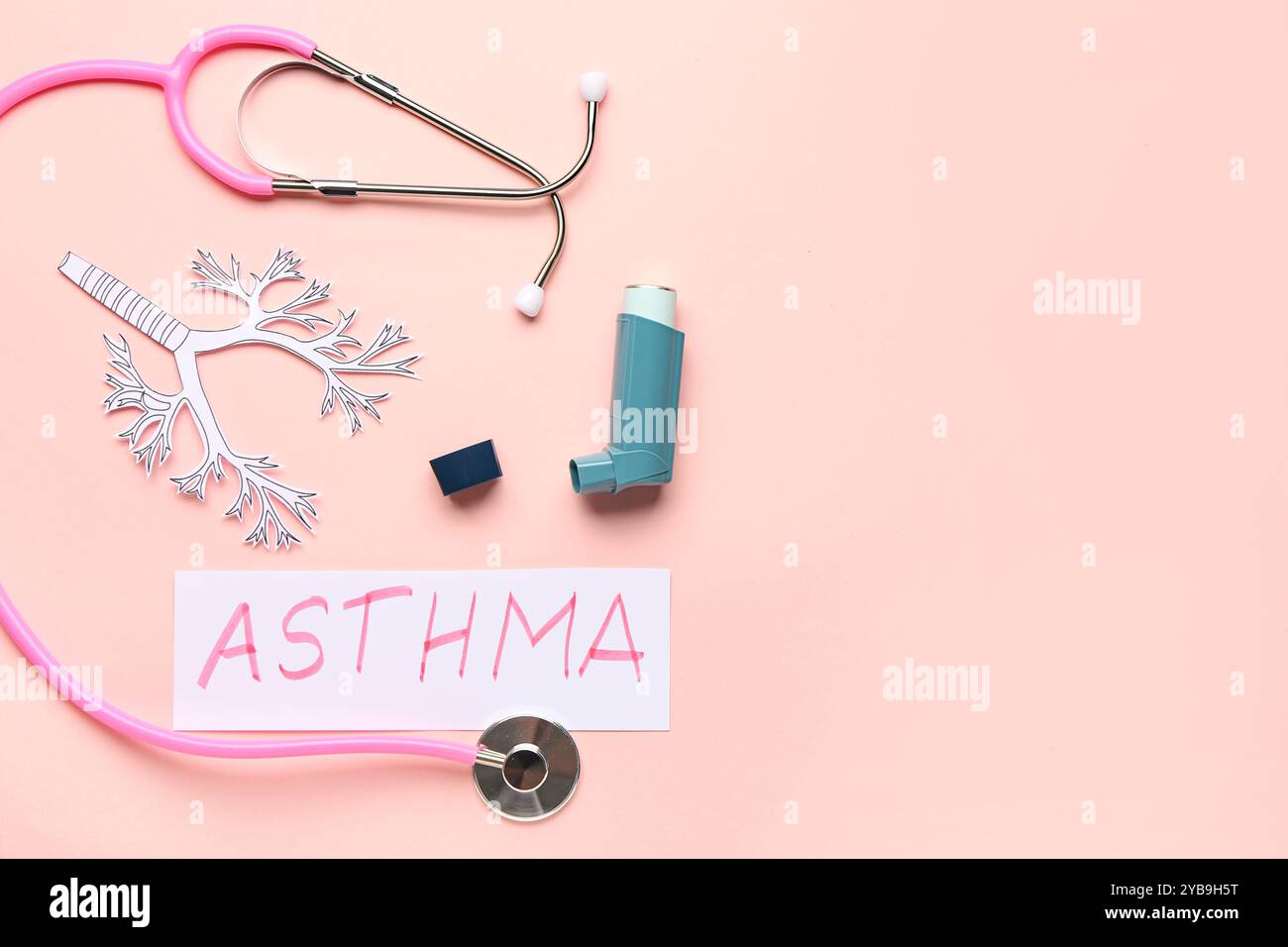 Composition with inhaler, paper lungs, stethoscope and piece of paper ...