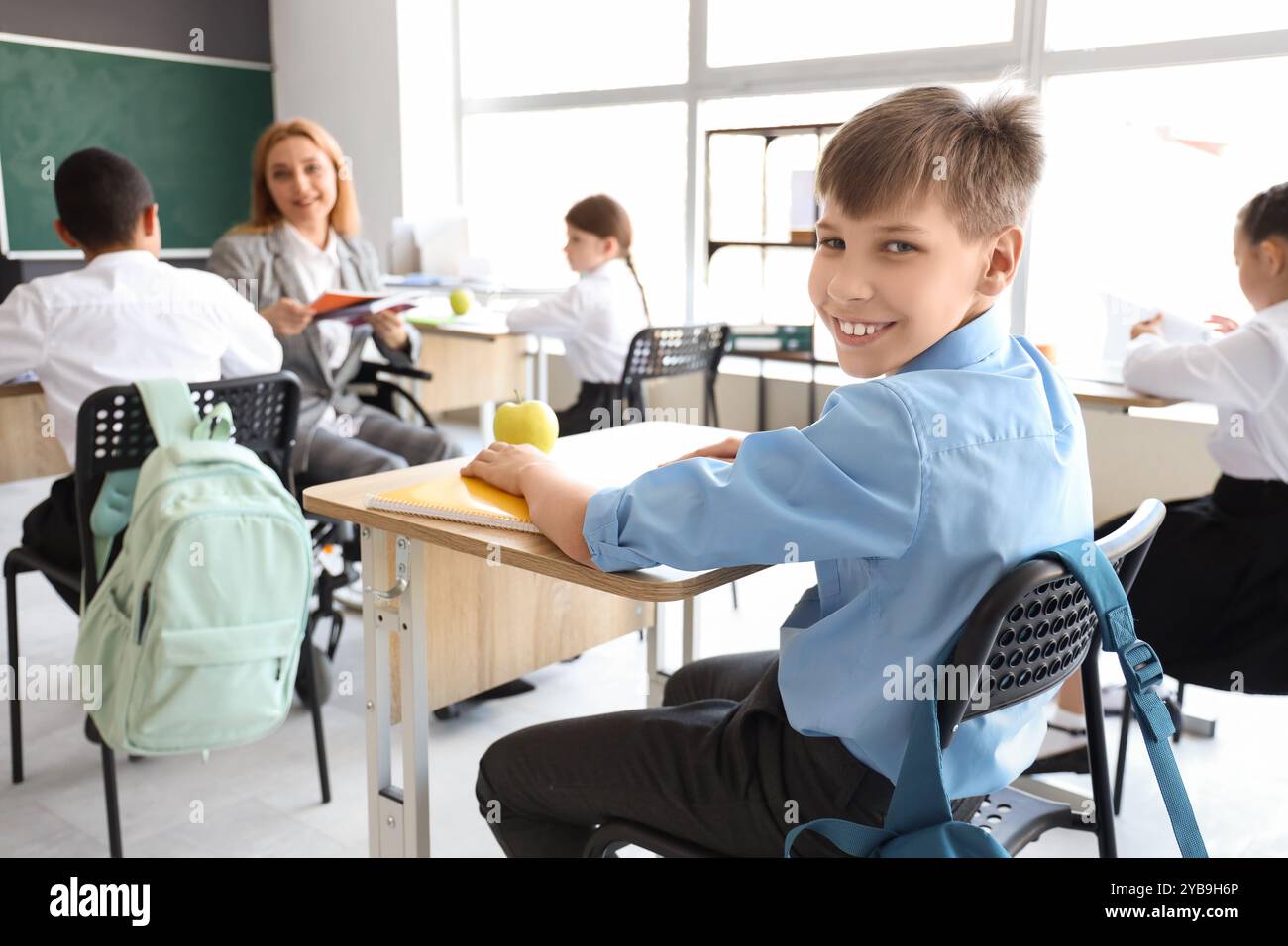 Little schoolboy having lesson in classroom, closeup Stock Photo - Alamy