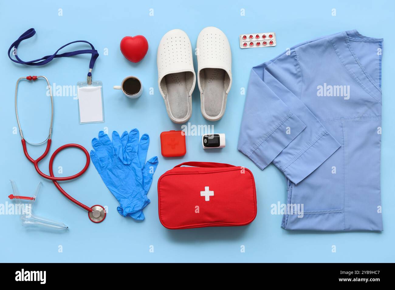 Medical student's uniform with supplies on blue background Stock Photo ...