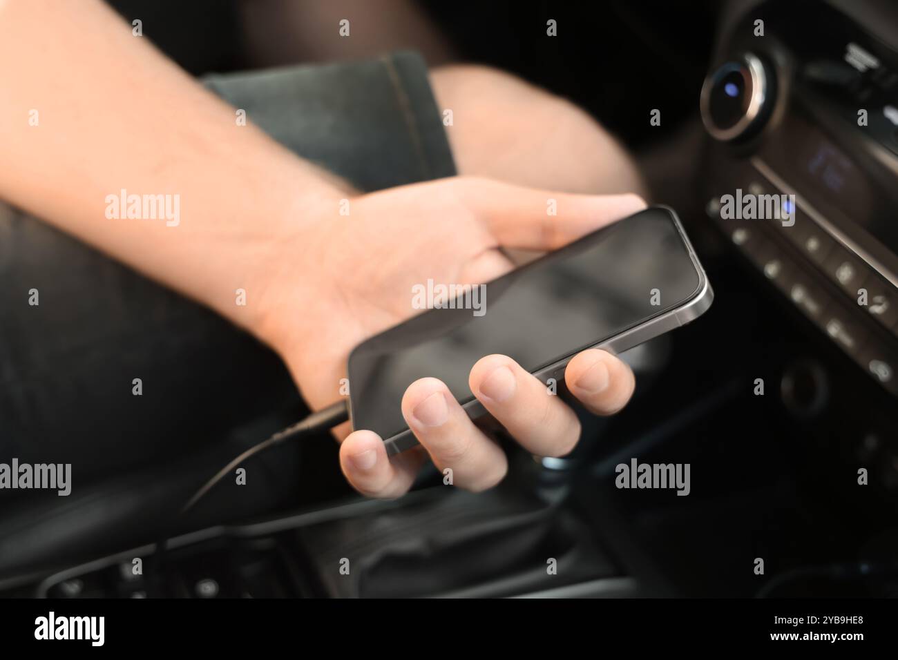 Male driver charging mobile hi-res stock photography and images - Alamy