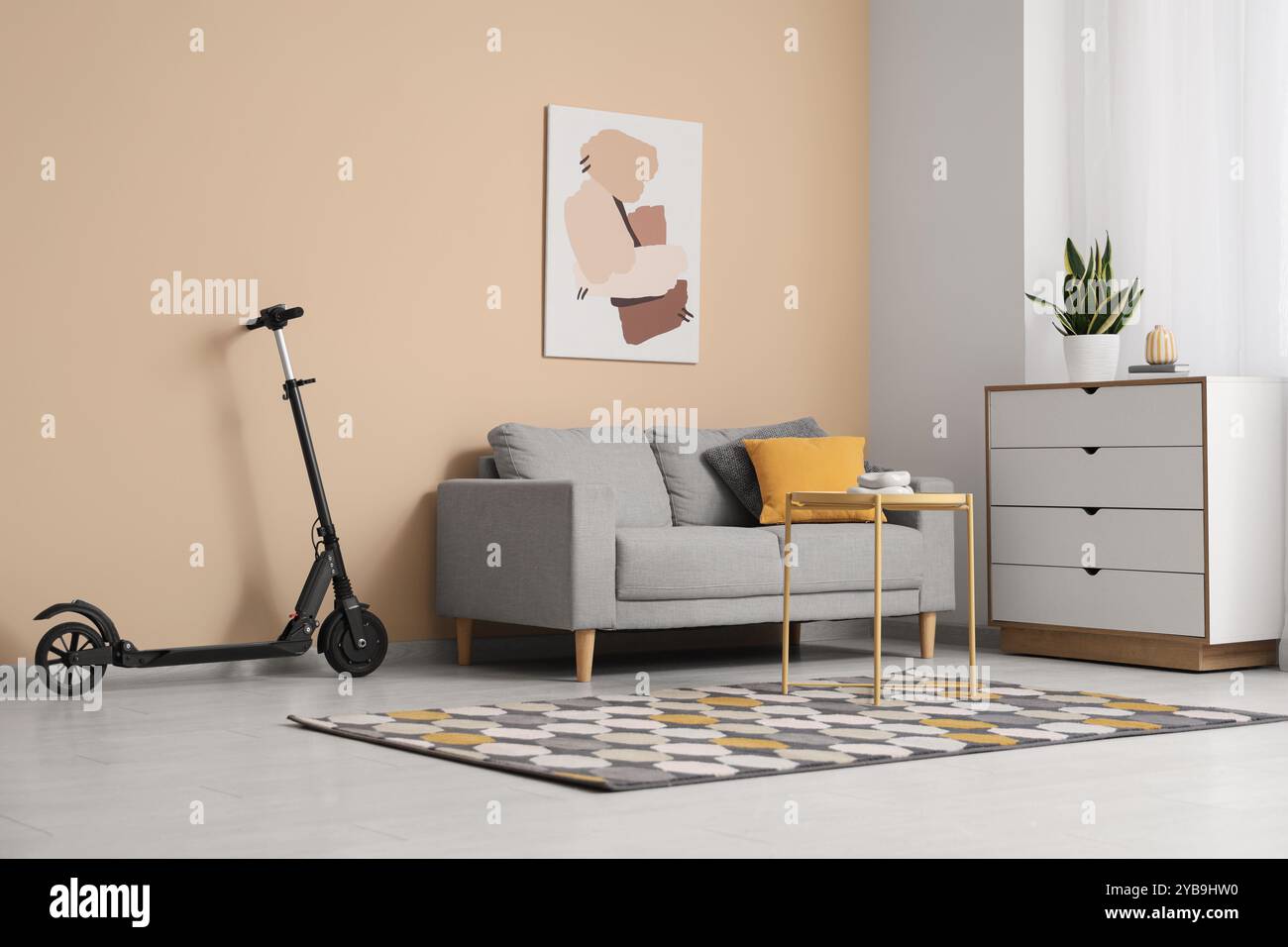 Interior of living room with electric scooter, sofa and table Stock ...
