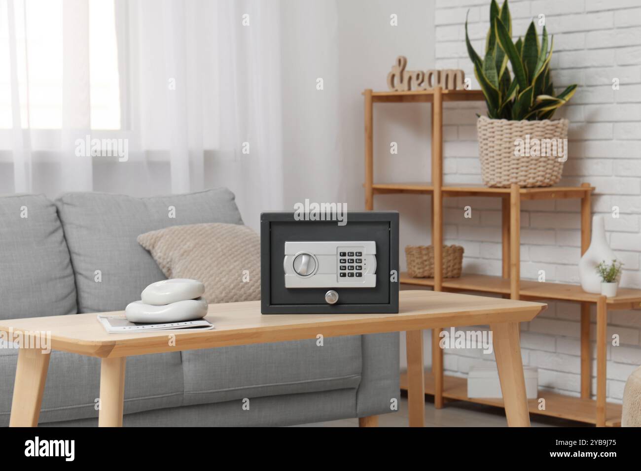 Modern safe on table in living room Stock Photo - Alamy