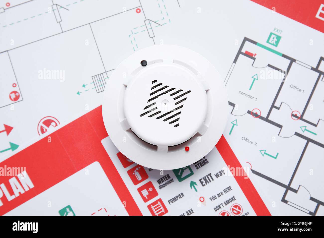 Modern smoke detector on evacuation plans, top view Stock Photo - Alamy