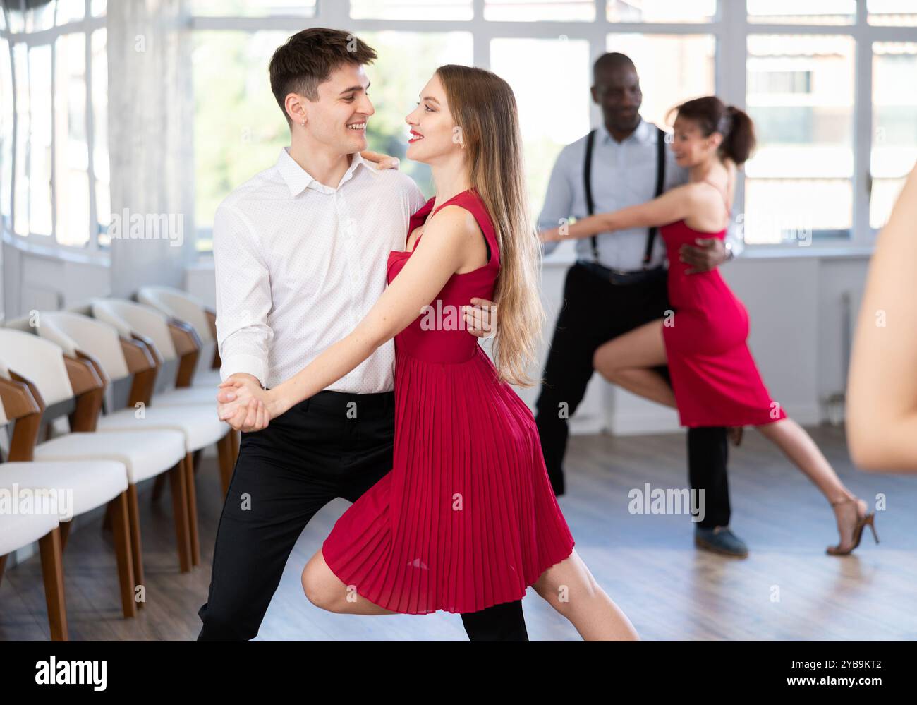 Young guy and young woman dancing tango Stock Photo - Alamy