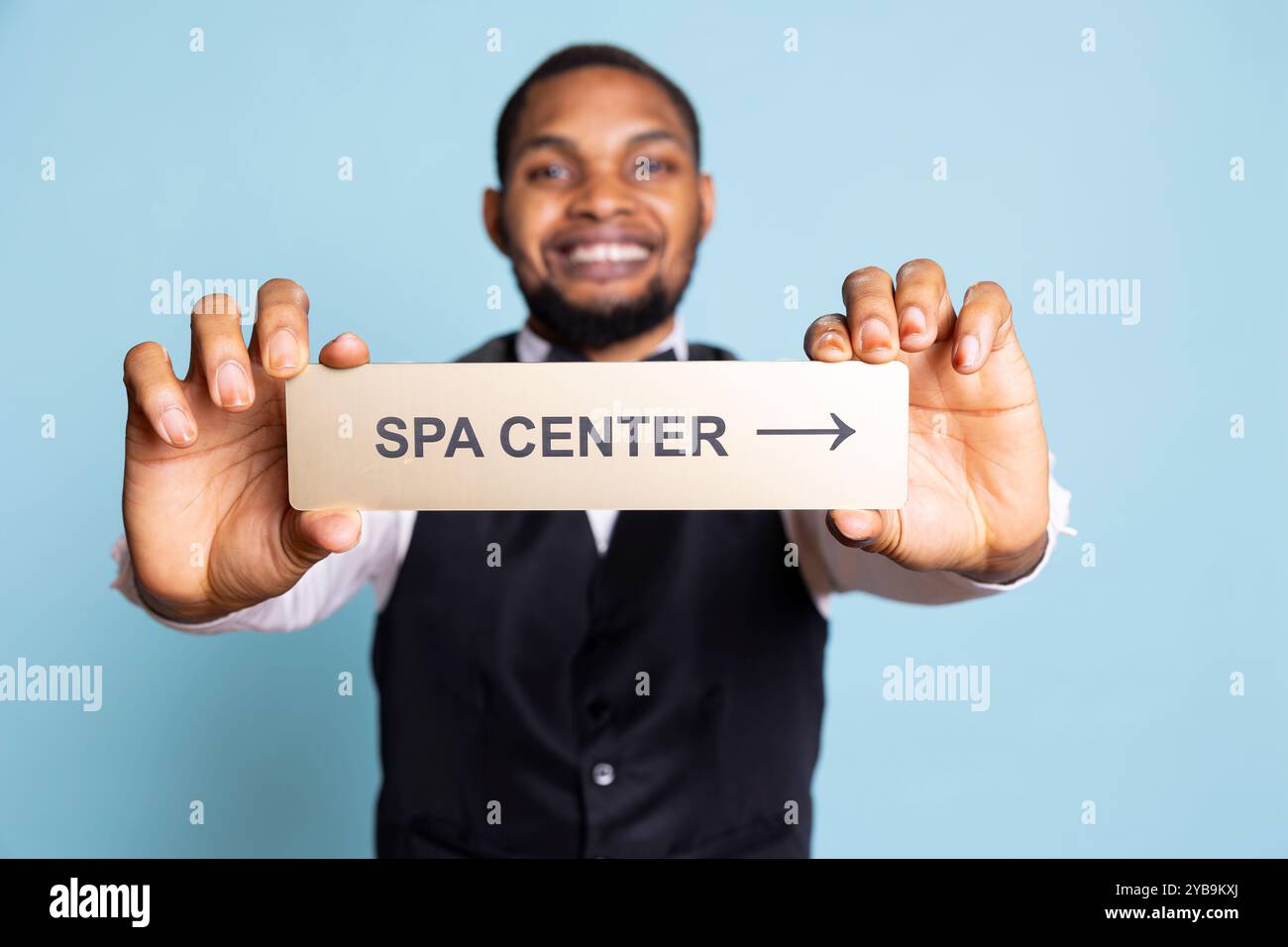 Five star resort staff showing the spa center wall indicator on camera ...