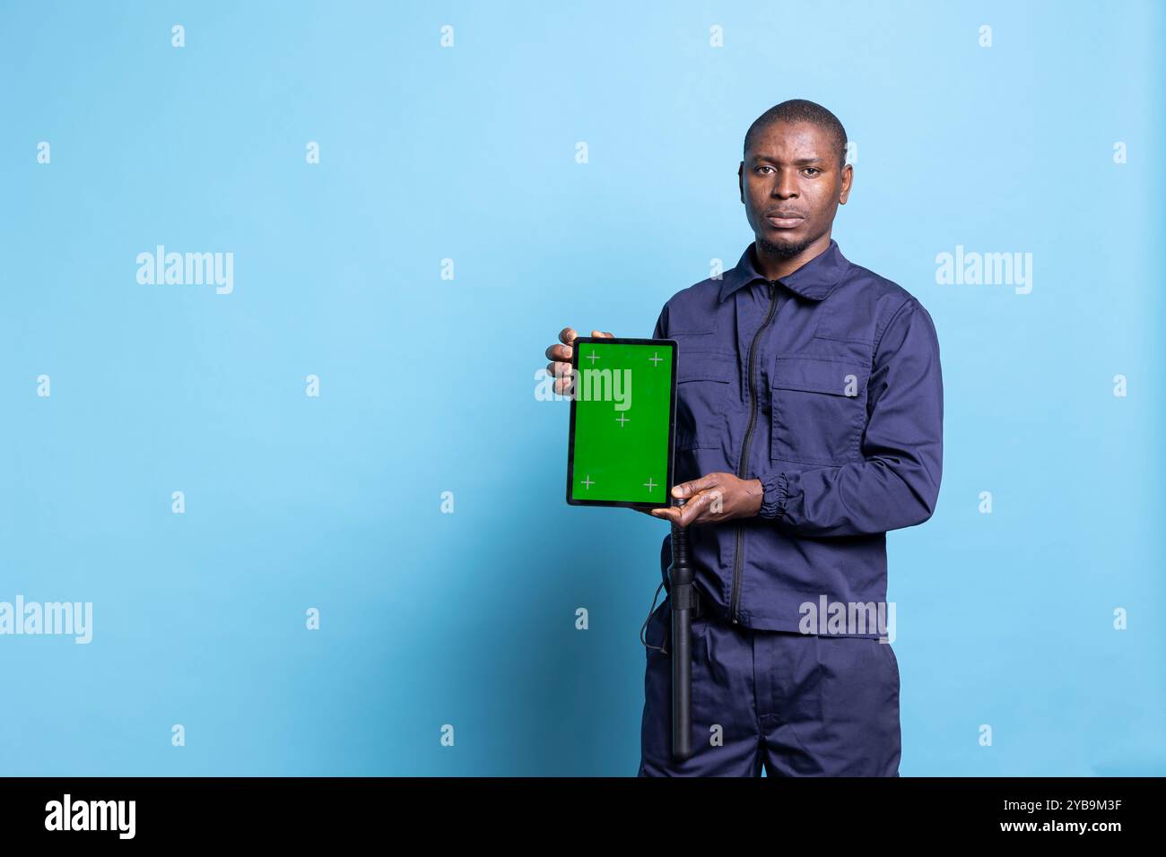 Mall security agent presenting a tablet with isolated mockup screen on ...