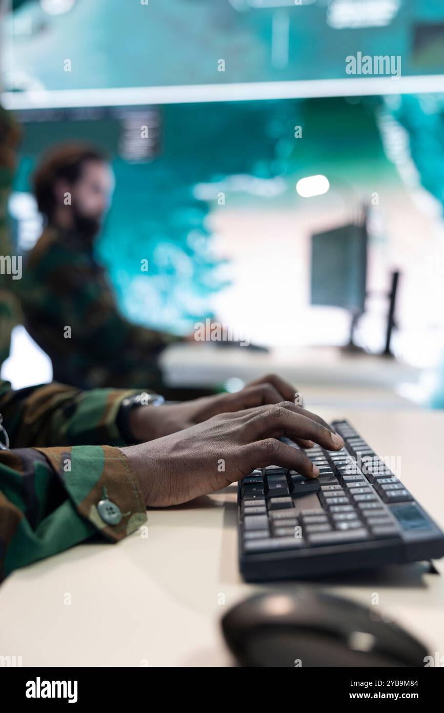 Army officer reviews operation details in a control center military ...