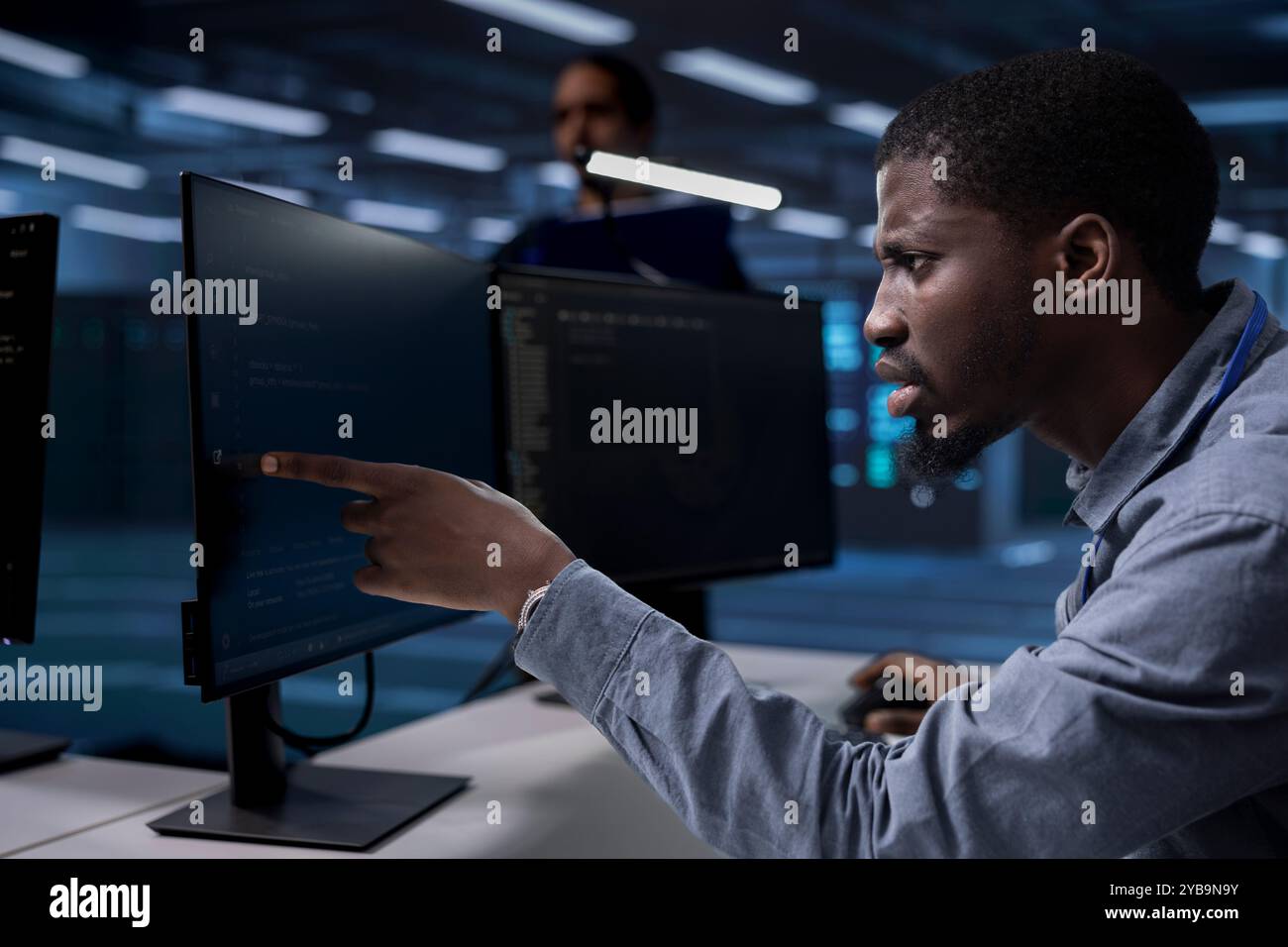 Server Hub Technician Frowning Confused By Errors On Screen While Shielding Data From Potential