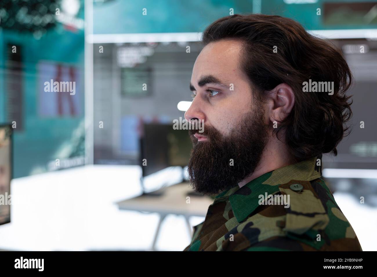 Major army officer studying surveillance satellite system on a world ...