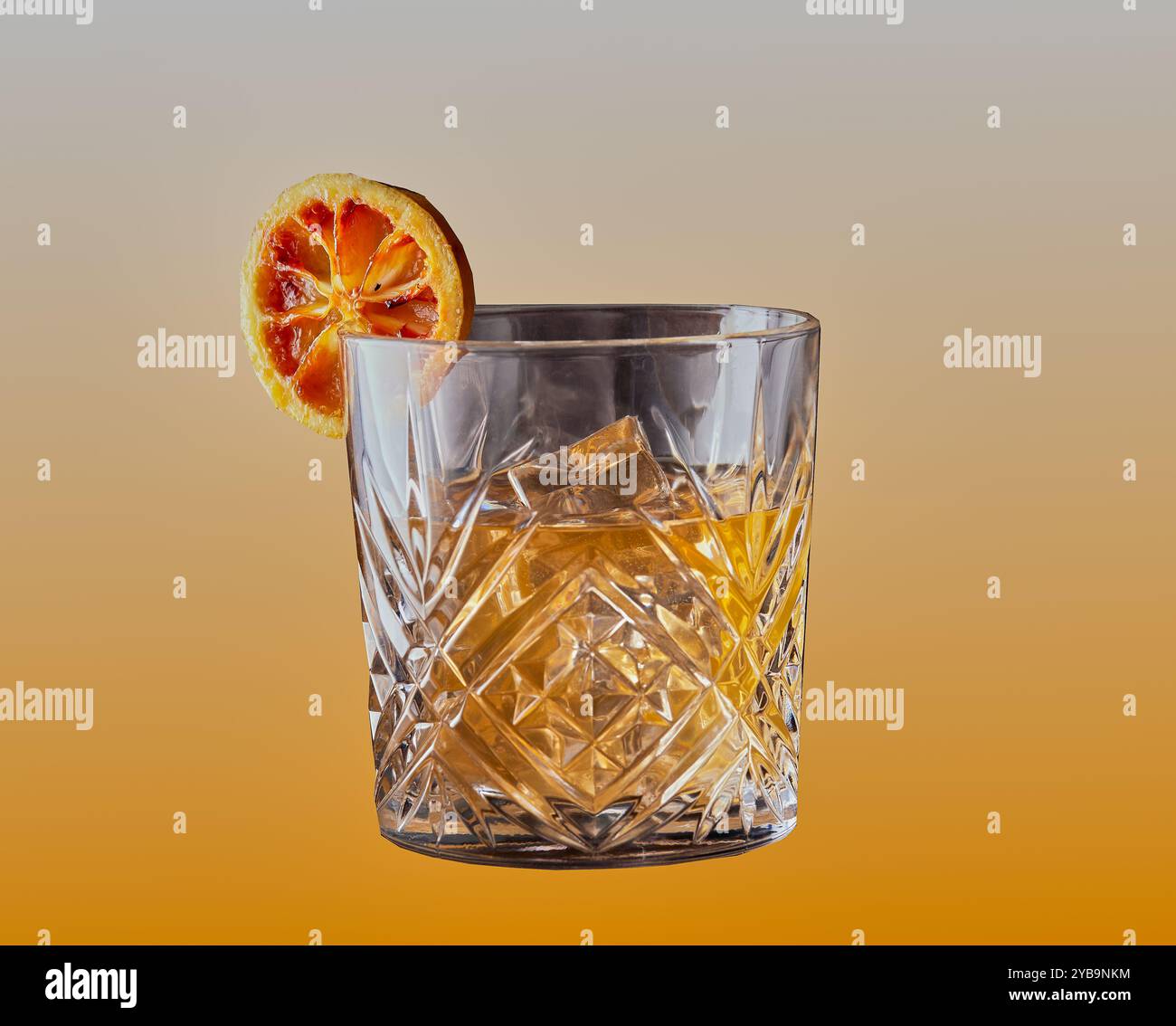 Whisky cocktail on a orange gradient background Stock Photo - Alamy