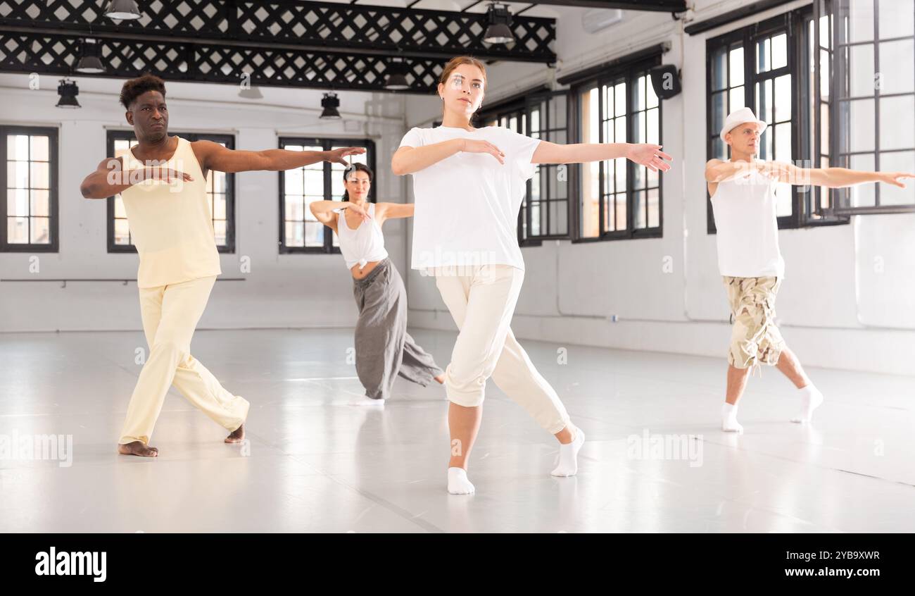 Group of young people learning modern dance movements Stock Photo - Alamy