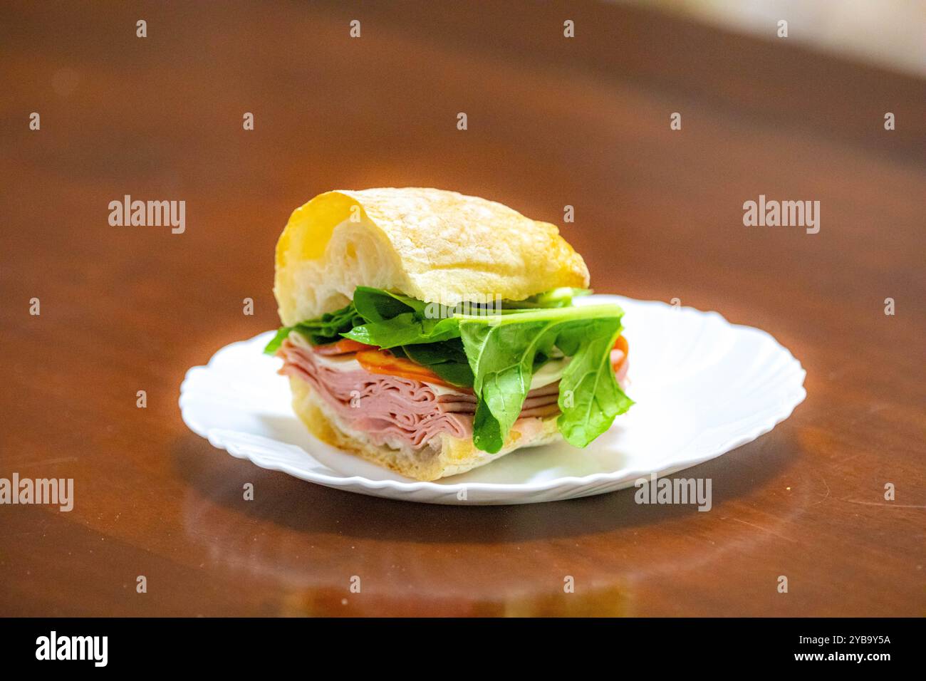 Italian mortadella bologna sandwich with arugula, tomato and cheese on ...