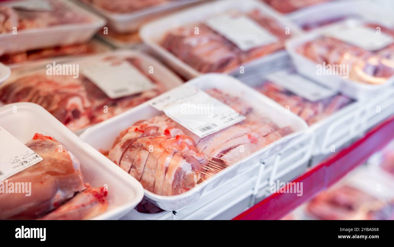 Packaged mutton meat laid out on display shelves of butcher store Stock ...